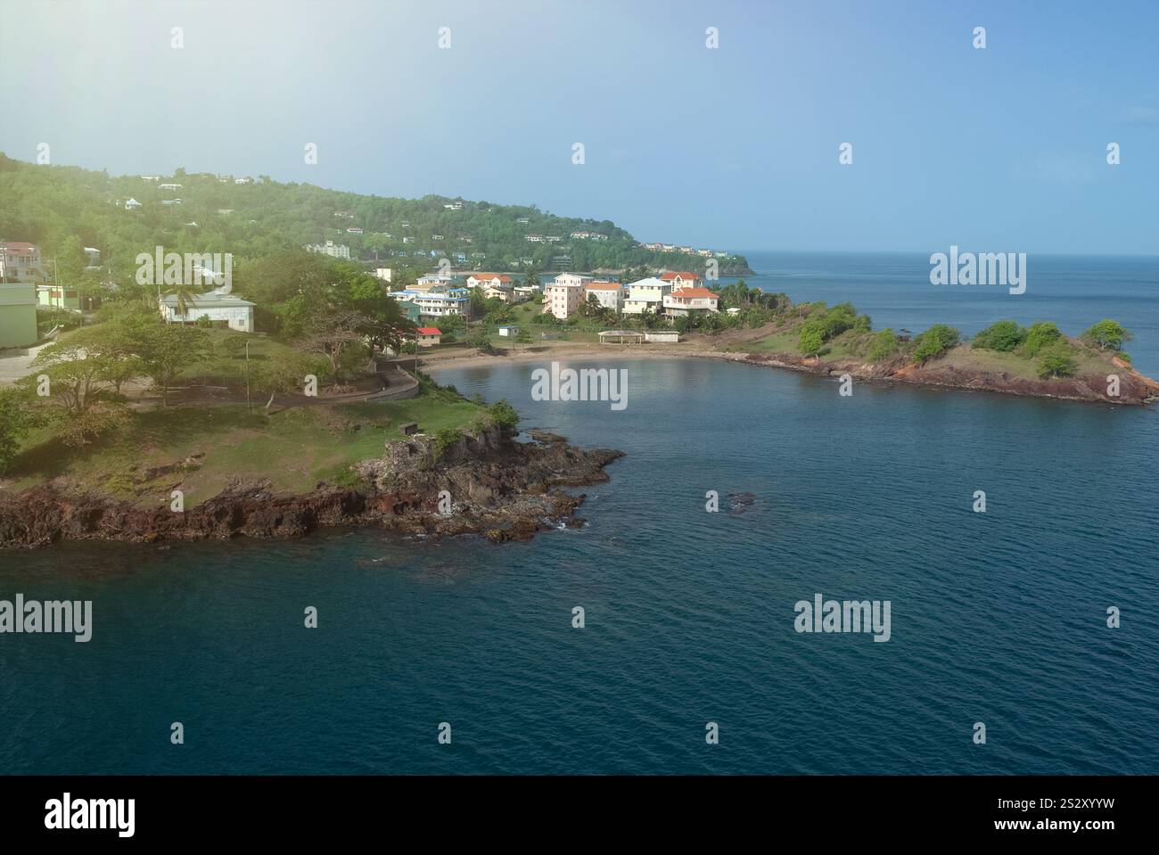 A picturesque coastal view of St. Lucia with lush greenery and ...