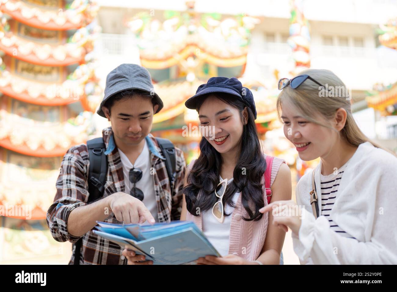 Friends discovering local culture while traveling city square travel ...