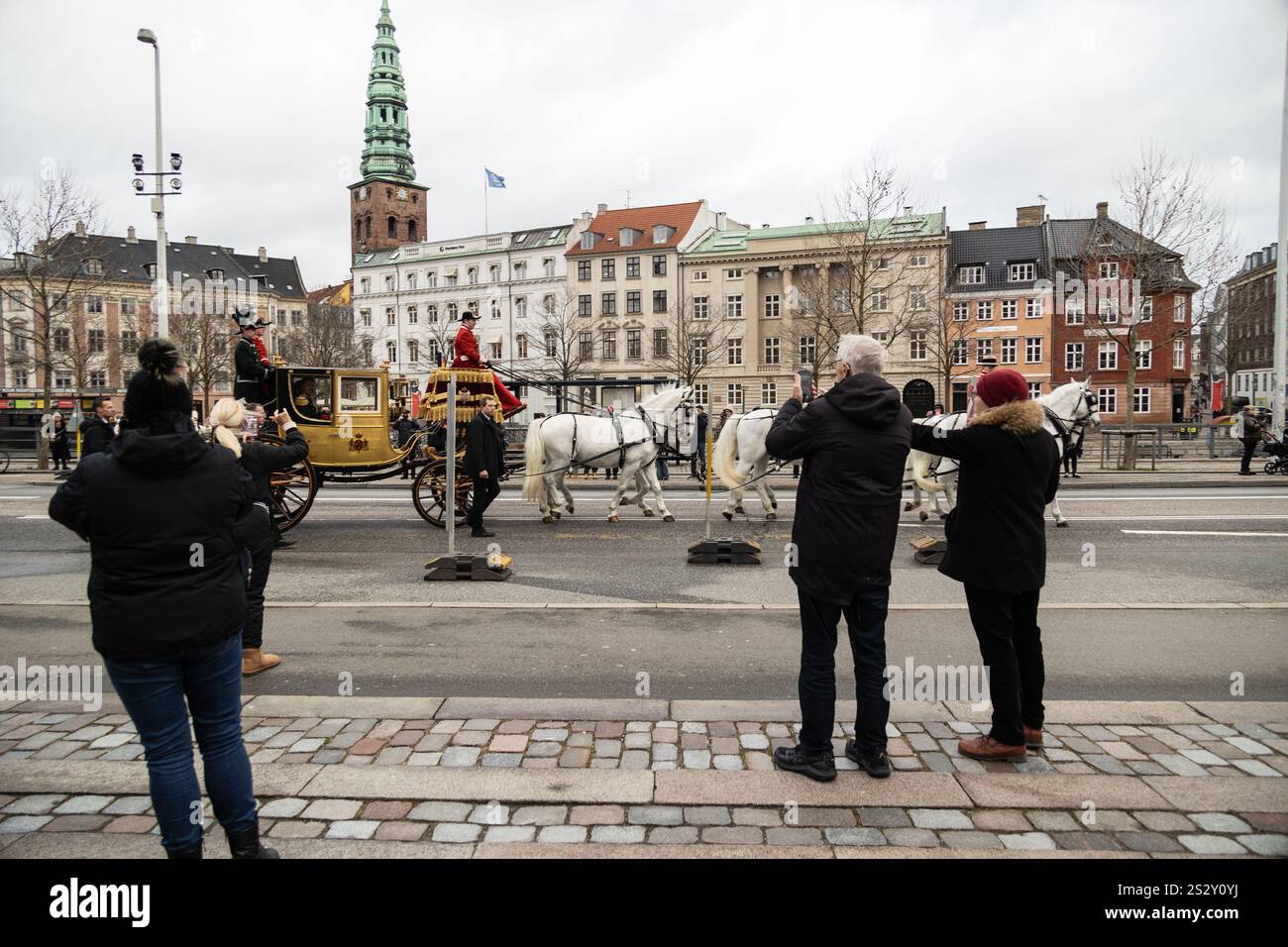 Danish citizens take photos of the Gold Coach carrying King Frederik X ...