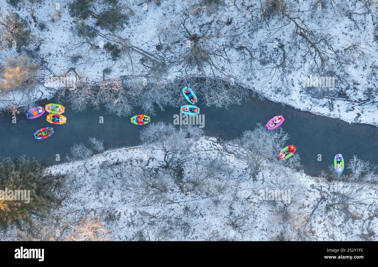 Aerial photo shows tourists experiencing rafting in Antu County ...