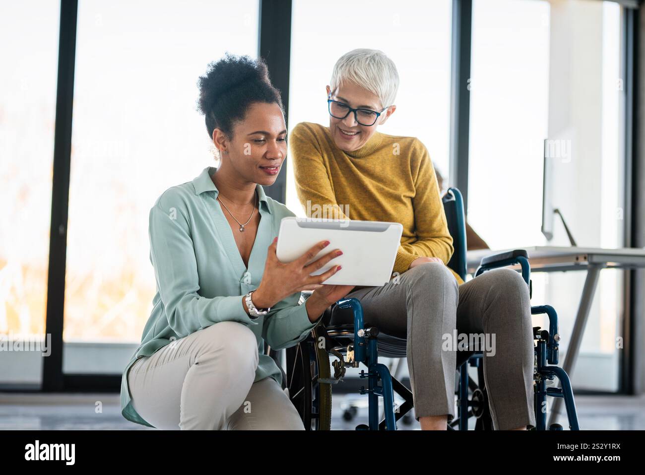 Multiracial coworkers analyzing charts and working together showing ...