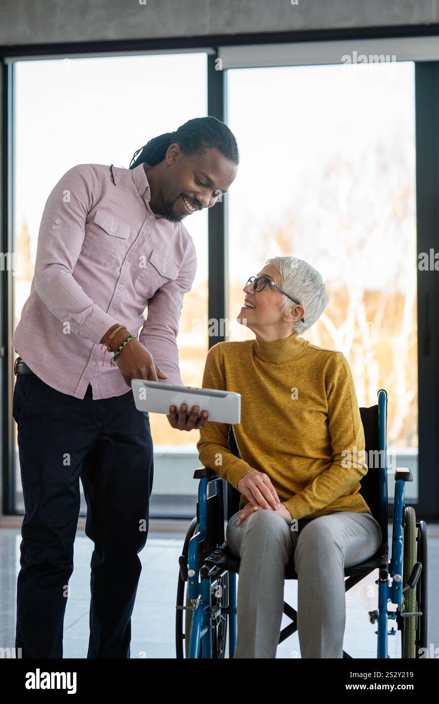 Multiracial coworkers analyzing charts and working together showing ...