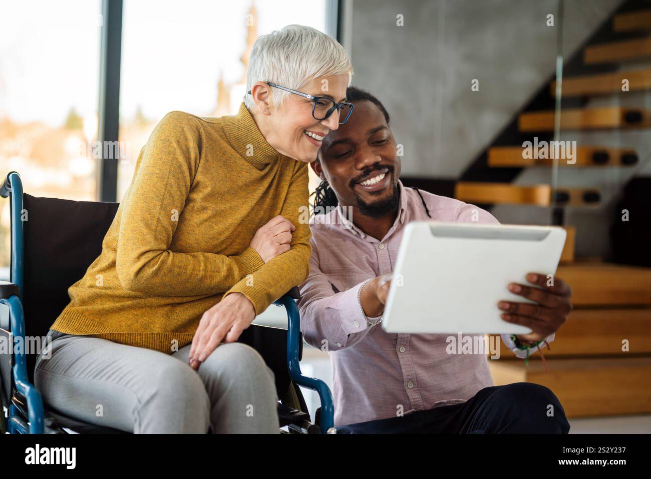 The image includes a person using a wheelchair, depicting inclusivity ...