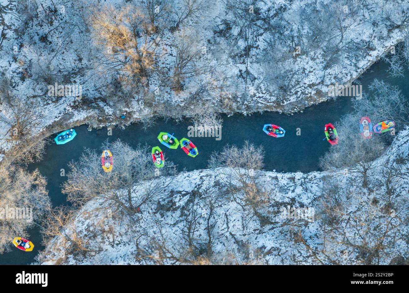 Aerial photo shows tourists experiencing rafting in Antu County ...