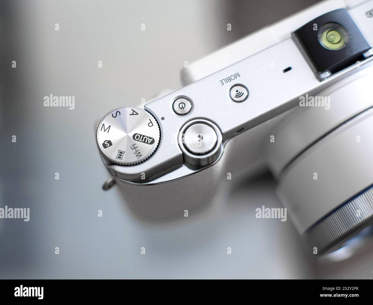 Top view of a white comact camera with device buttons function isolated ...
