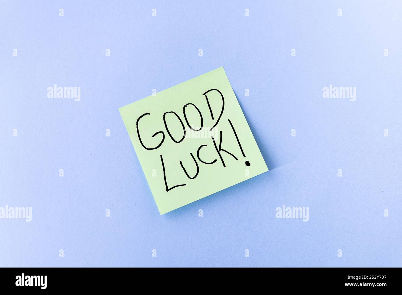 A yellow, heart-shaped Post-It note with the handwritten message "Good ...