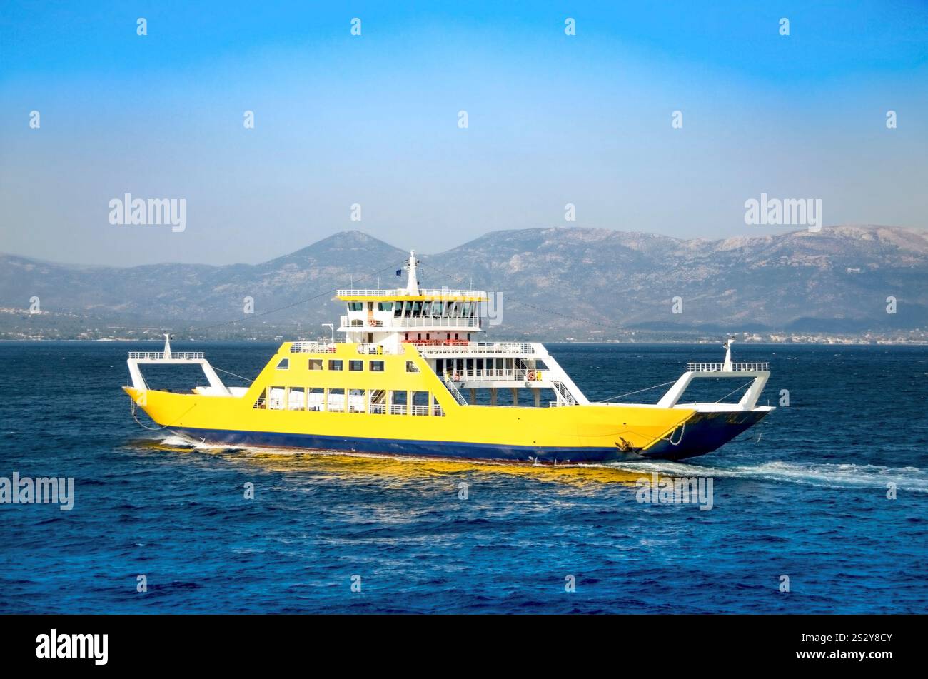 Yellow ferry boat for the transport of people and cars Stock Photo - Alamy