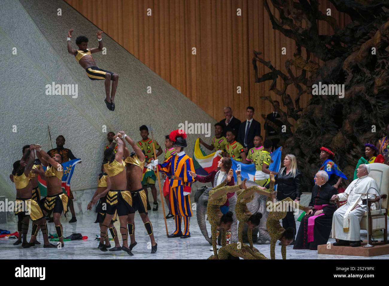 Pope Francis, right, looks at a performance by CircAfrica circus troupe ...