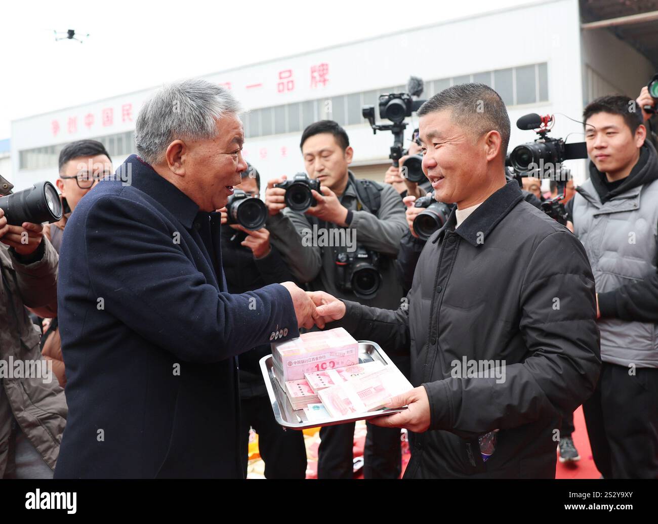 NANCHANG, CHINA - JANUARY 8, 2025 - Ling Jihe (left), a major grain ...