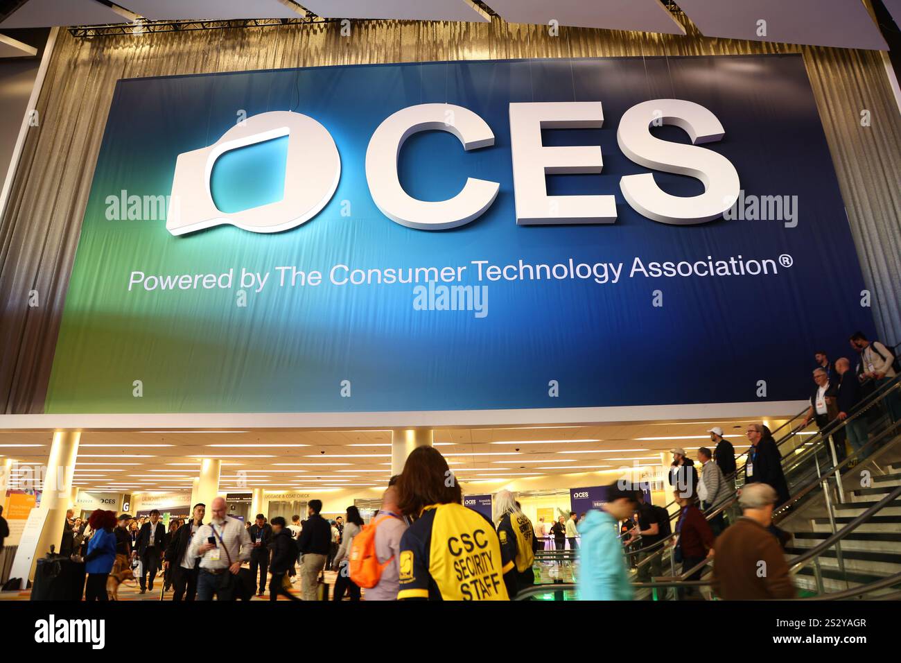 A view of attendees walking by a large CES sign during the 2025 ...
