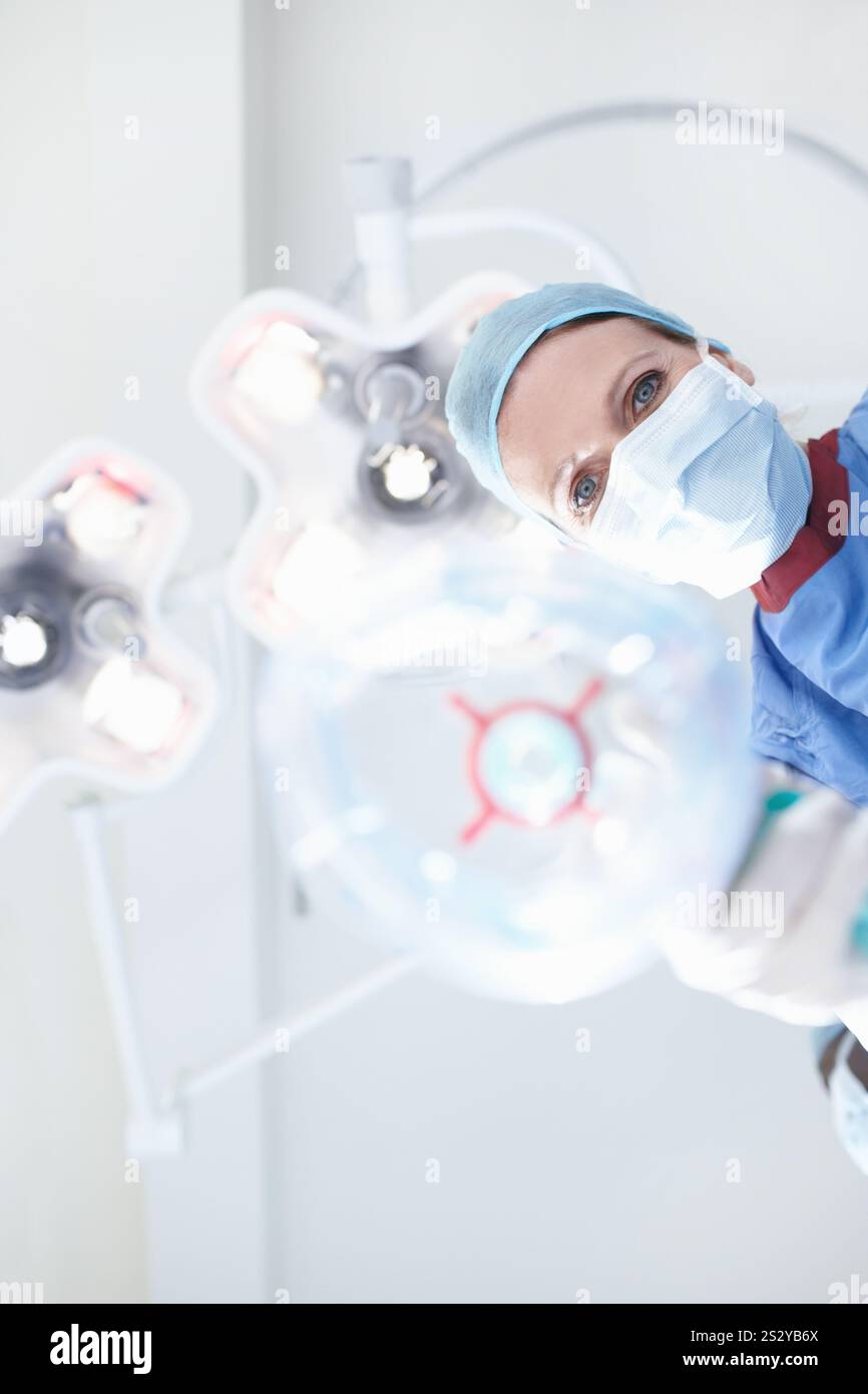 Doctor, oxygen and mask for operation in theatre with anaesthesia ...