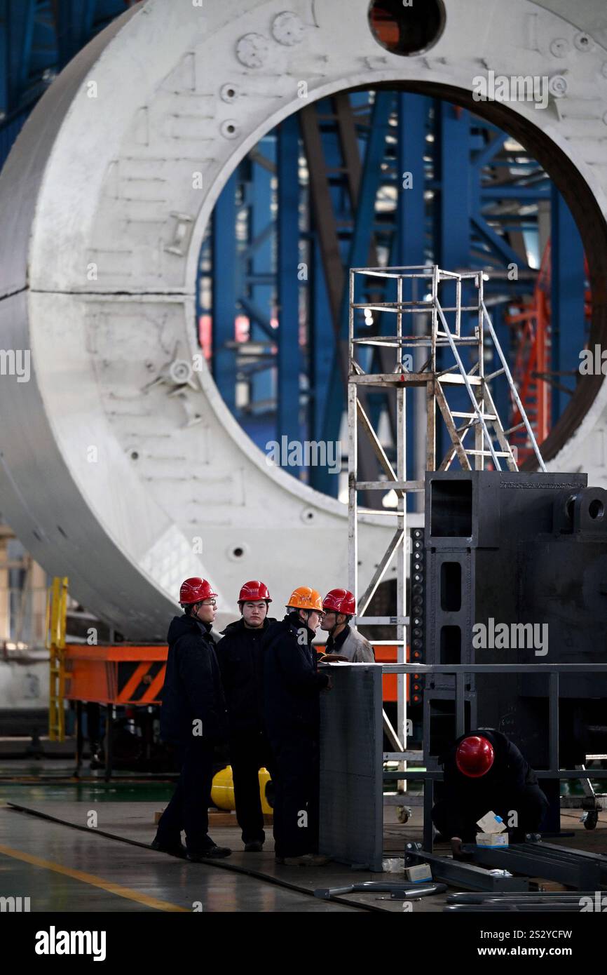 SHENYANG, CHINA - JANUARY 8, 2025 - Workers assemble the first ...