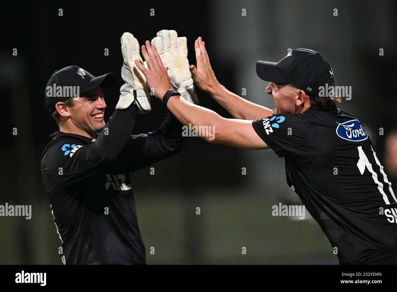 New Zealand's Nathan Smith, right, celebrates with teammate Tom Latham ...