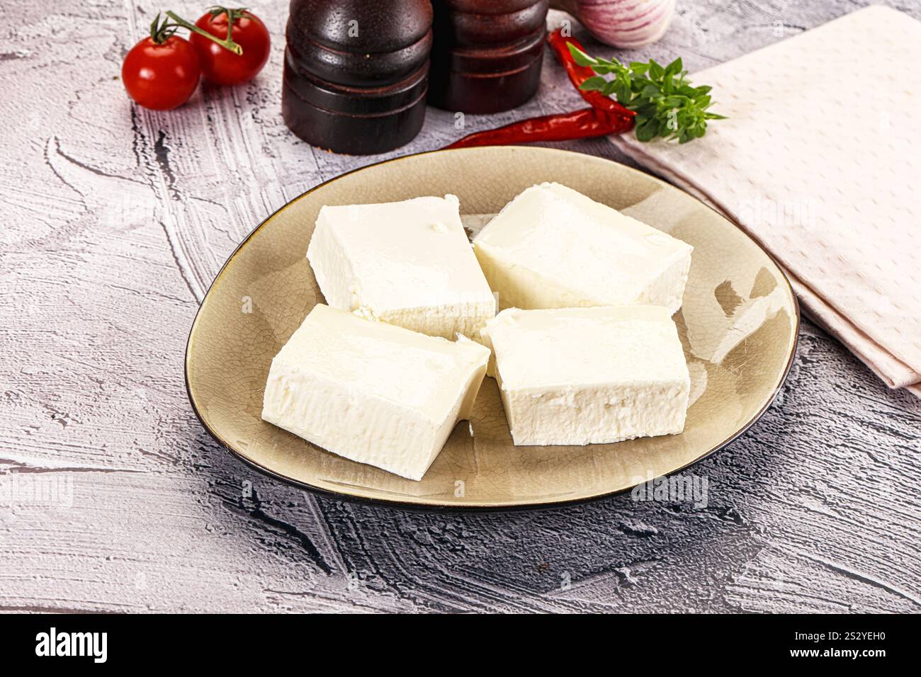 Greek traditional cuisine - Feta cheese bricks Stock Photo - Alamy