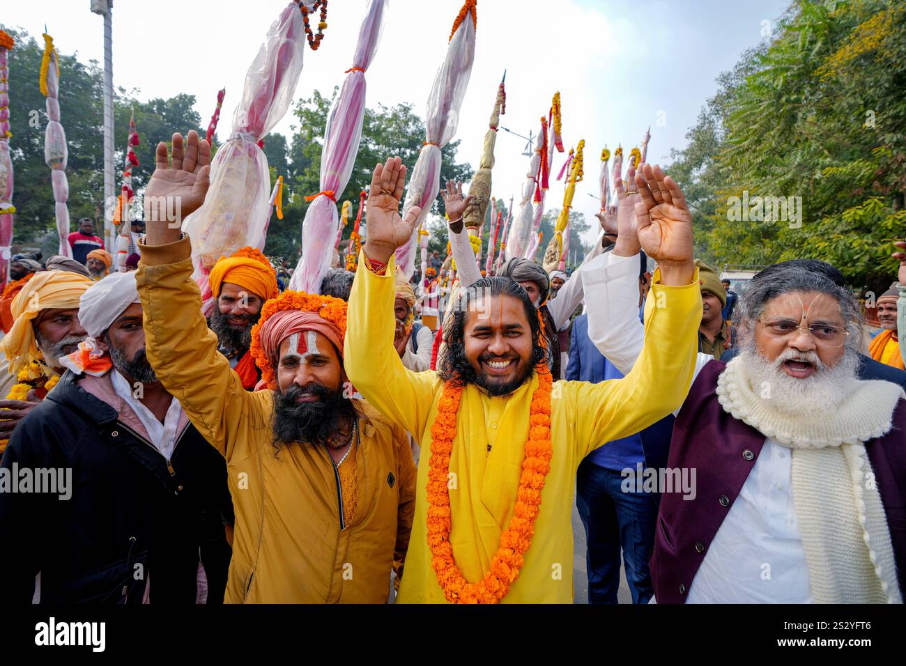 Hindu holy men participate in a procession towards the Sangam, the ...