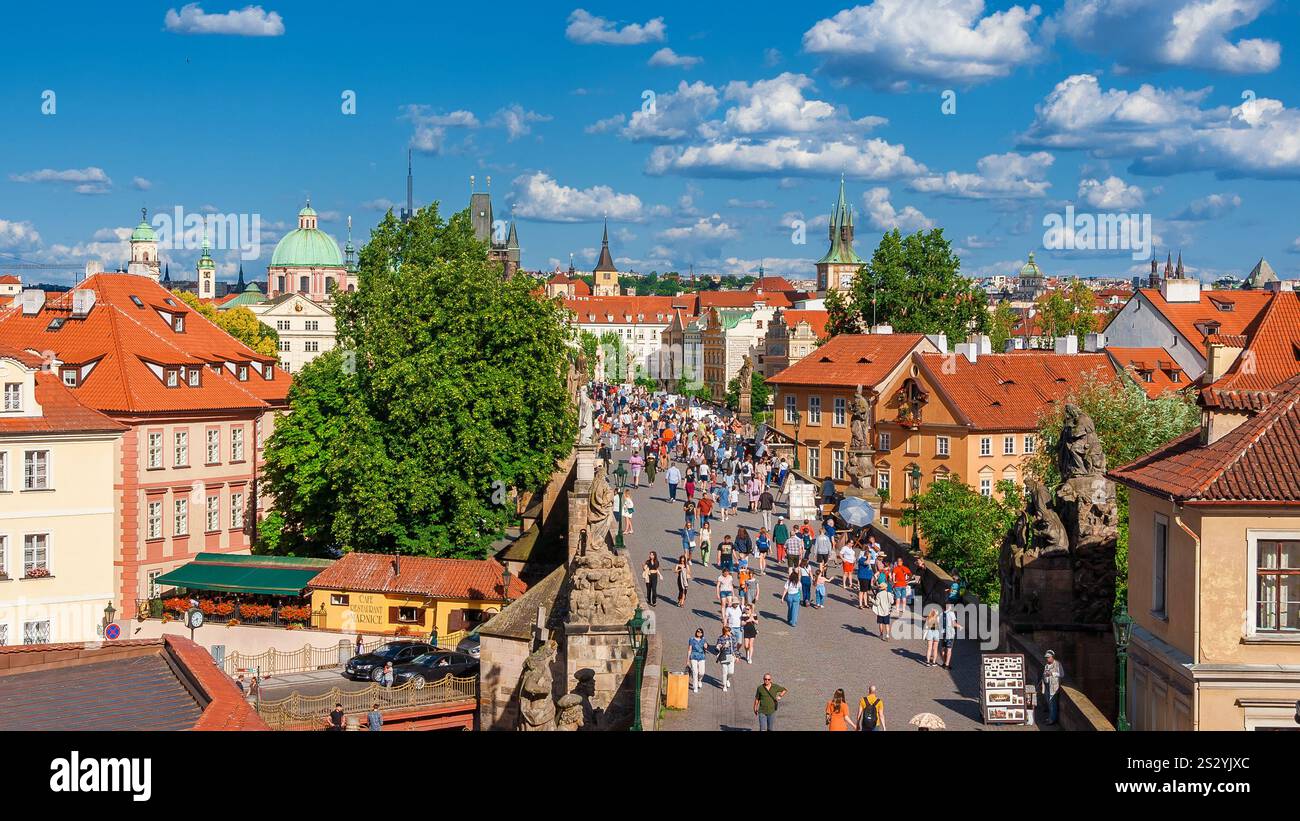 Tourism in Prague. Czech people and tourists cross the famous Charles ...
