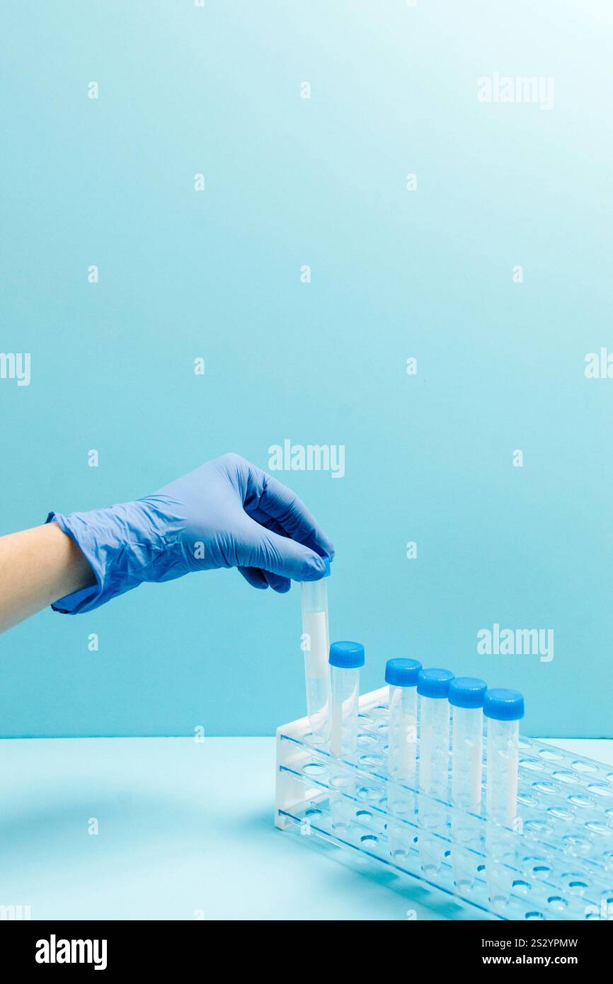 Lab worker holding sample tube hi-res stock photography and images - Alamy