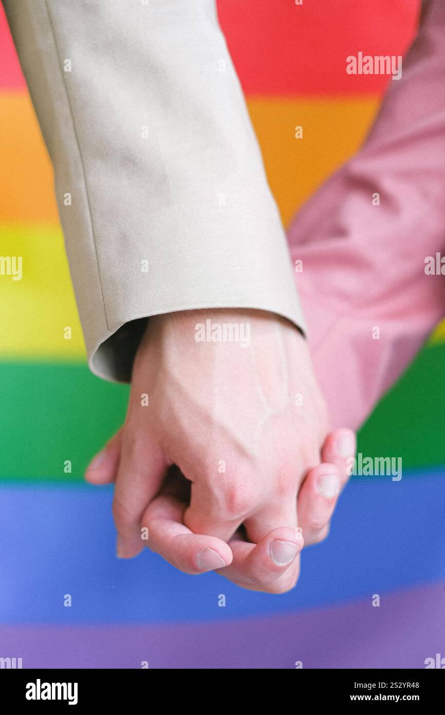 Two LGBT guys holding hands Stock Photo - Alamy