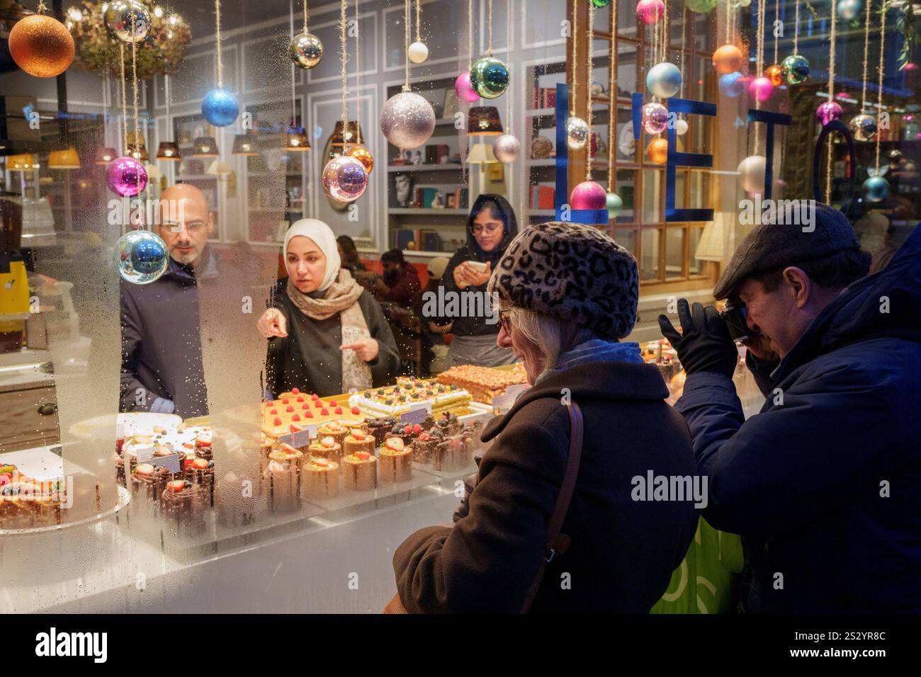 Customers choose cakes in the window of L'Eto, an upmarket cafe on ...
