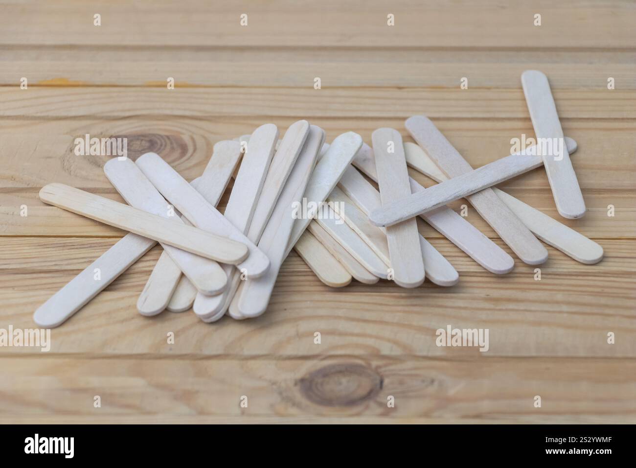 wooden popsicle sticks for craft activities on a table, close-up view ...