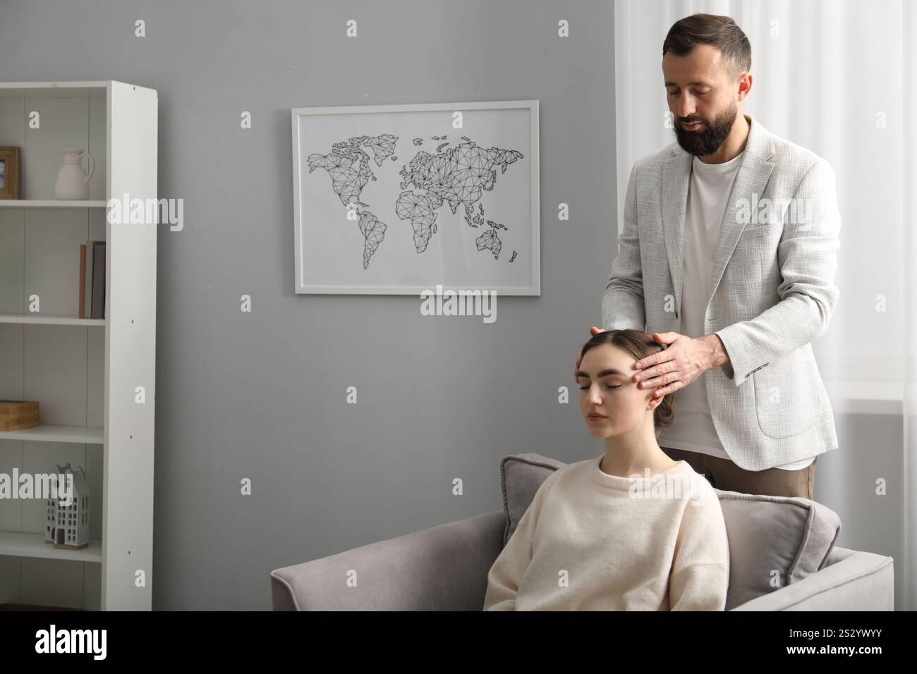 Psychologist working with patient during hypnosis session indoors Stock ...