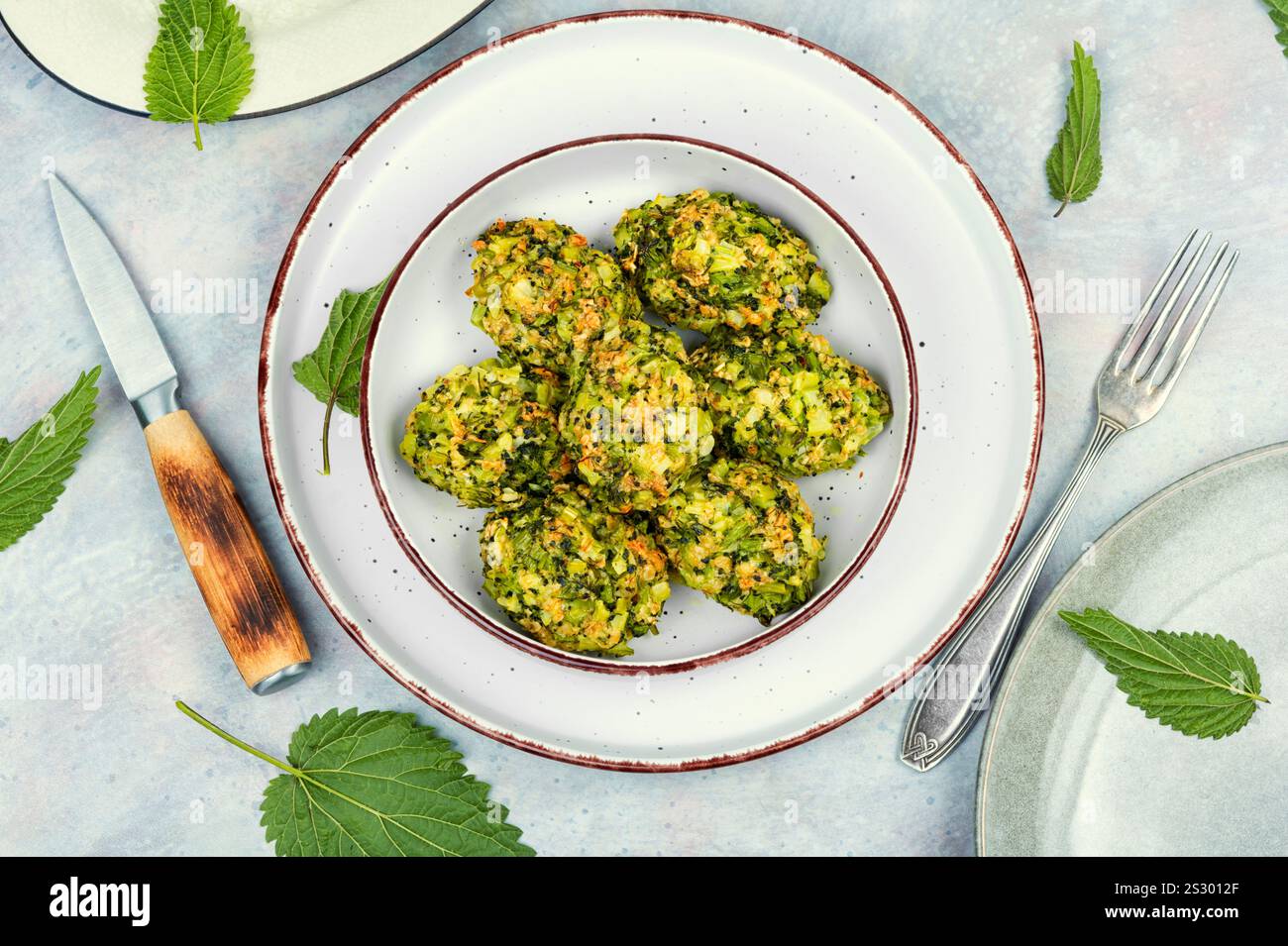 Baked green dietary cutlets made from young nettles. Vegetarian food ...