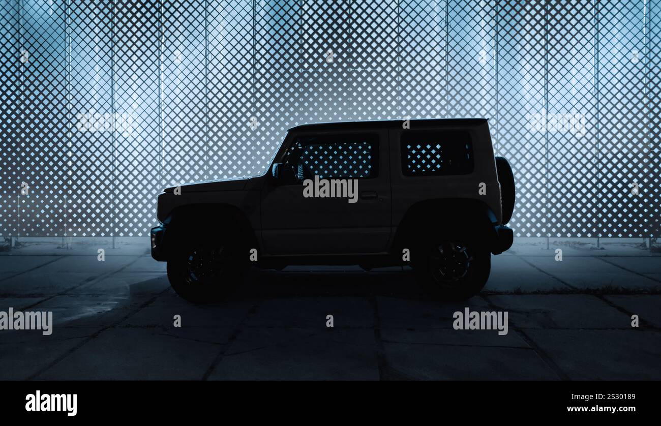 Black silhouette of 3-door SUV at night. Side view of backlit off ...