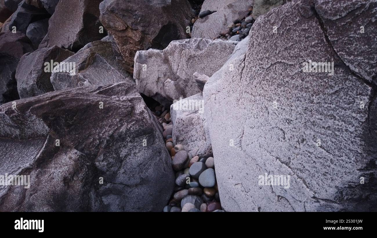 The cool Melted Rocks of Swamis Beach. Erosion control boulders placed ...