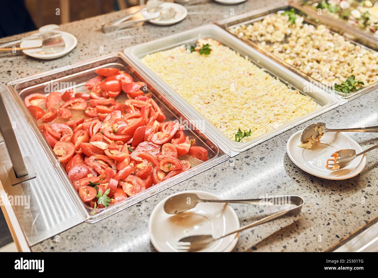 Selective focus on fresh sliced tomatoes and mimosa salad, traditional ...