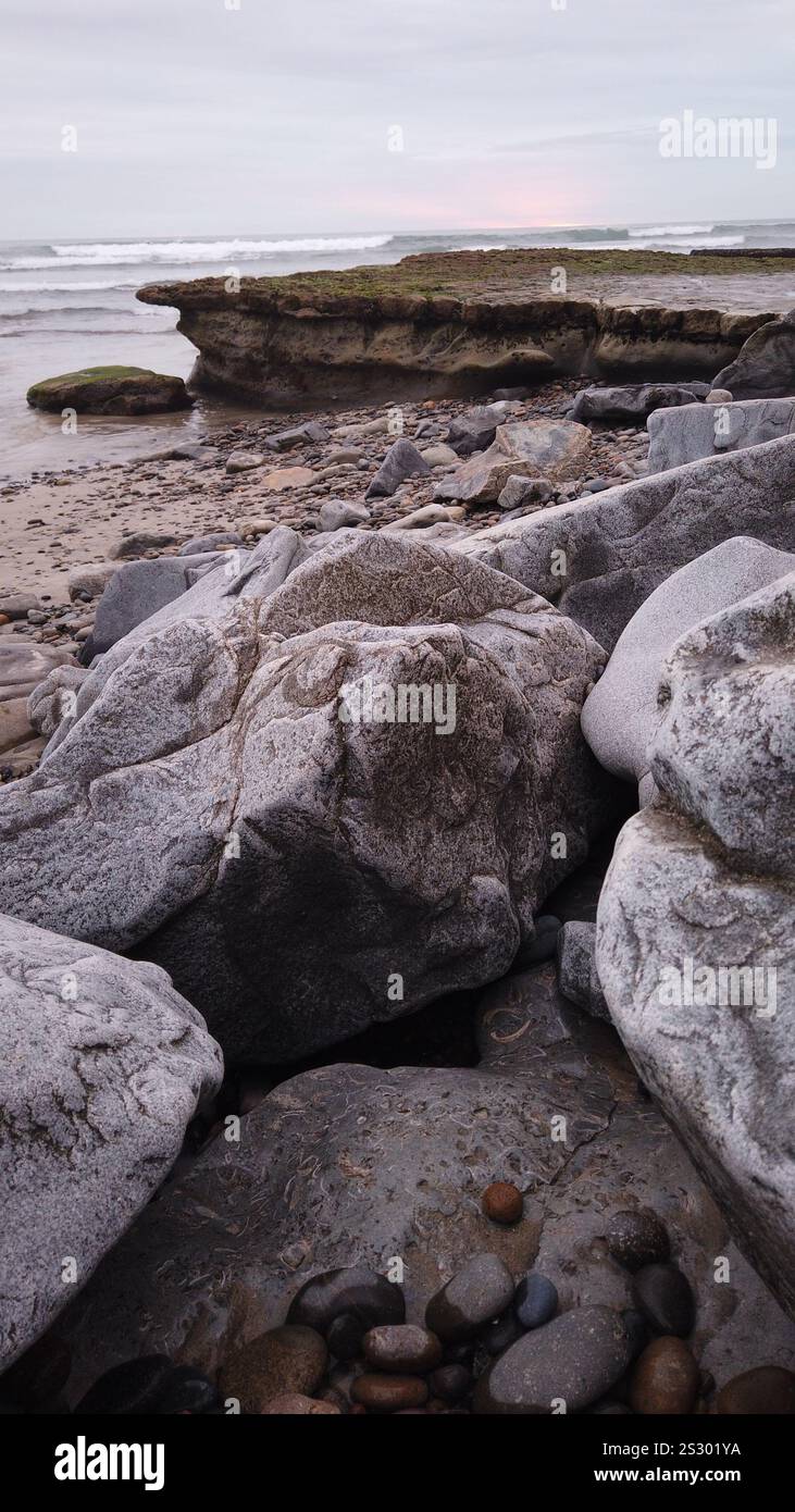 The cool Melted Rocks of Swamis Beach. Erosion control boulders placed ...