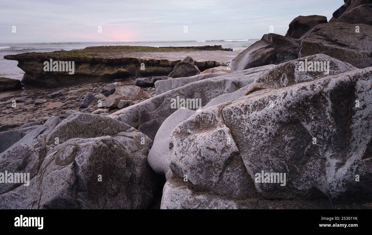 The cool Melted Rocks of Swamis Beach. Erosion control boulders placed ...