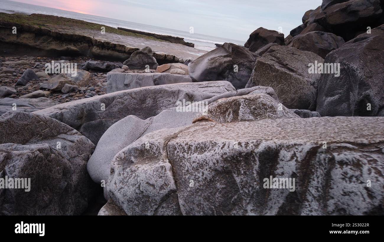 The cool Melted Rocks of Swamis Beach. Erosion control boulders placed ...