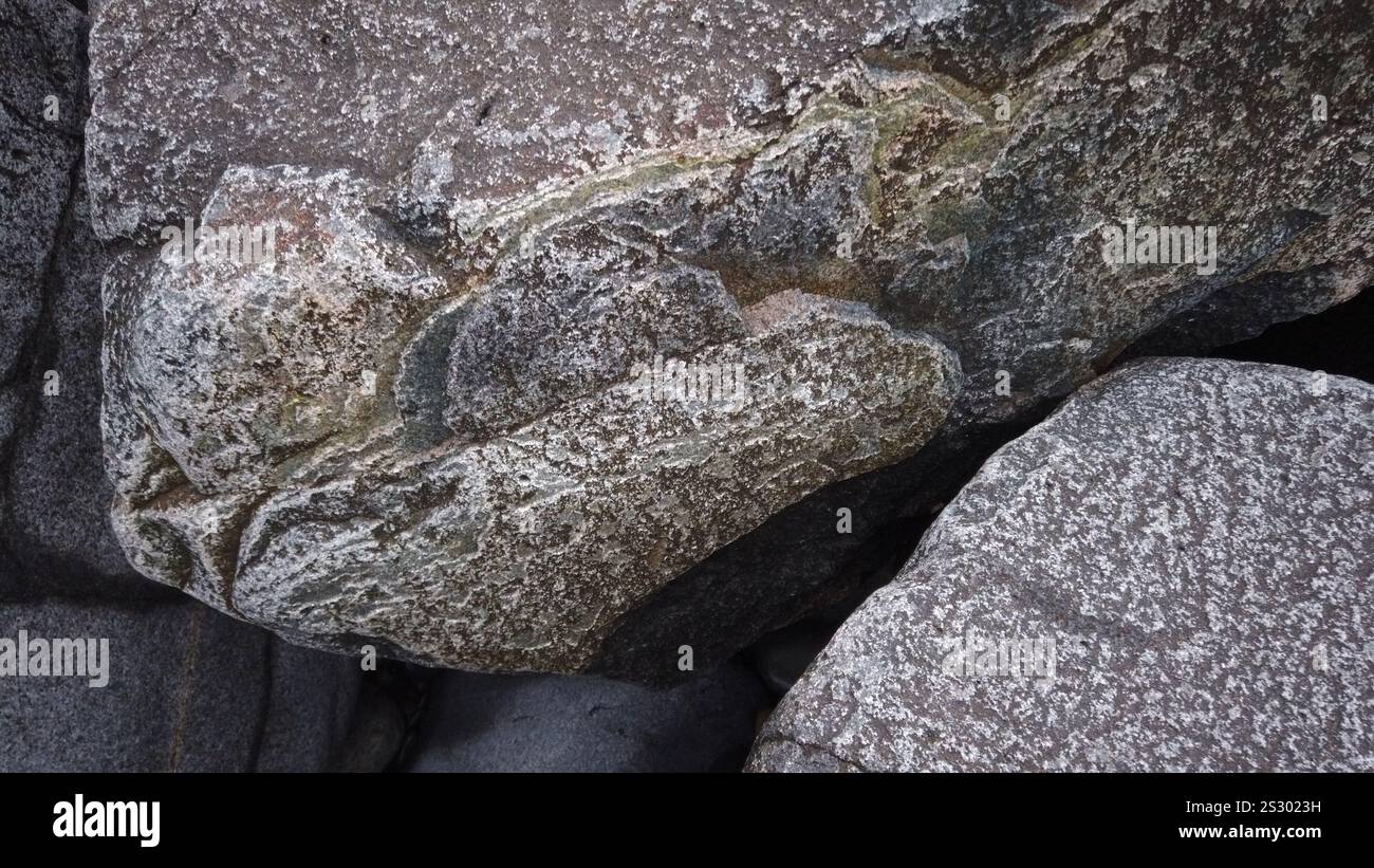 The cool Melted Rocks of Swamis Beach. Erosion control boulders placed ...