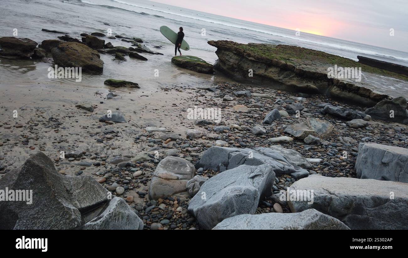 The cool Melted Rocks of Swamis Beach. Erosion control boulders placed ...