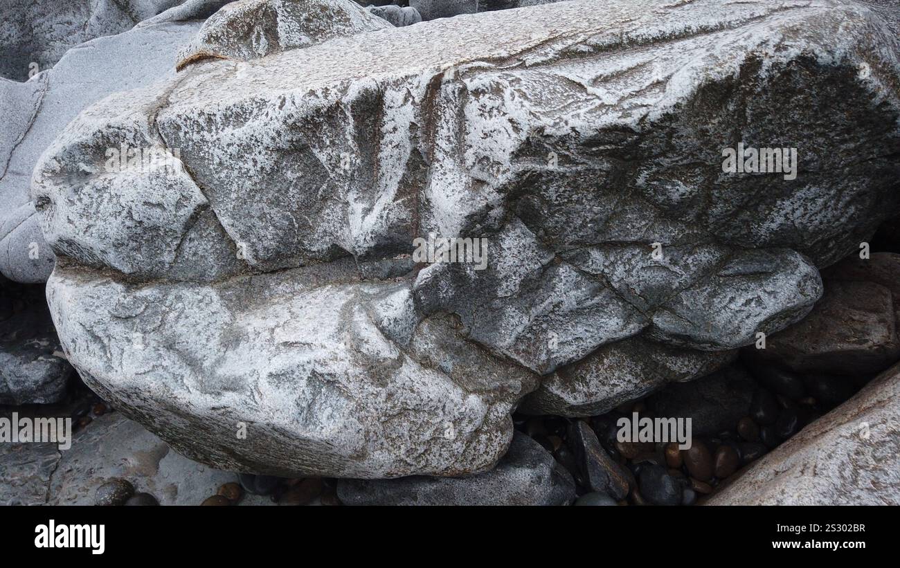 The cool Melted Rocks of Swamis Beach. Erosion control boulders placed ...