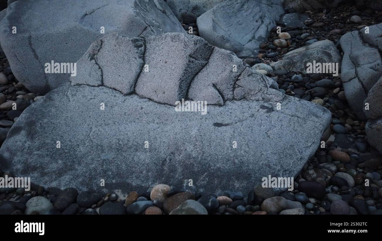 The cool Melted Rocks of Swamis Beach. Erosion control boulders placed ...