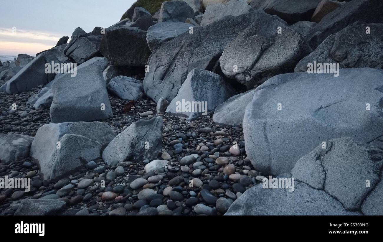 The cool Melted Rocks of Swamis Beach. Erosion control boulders placed ...