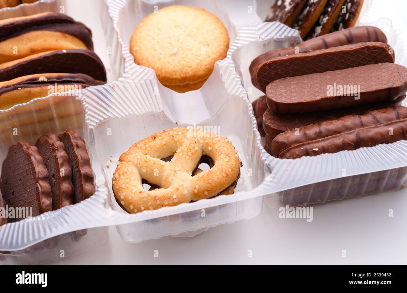 Different kinds of cookies in plastic box on white background Stock ...
