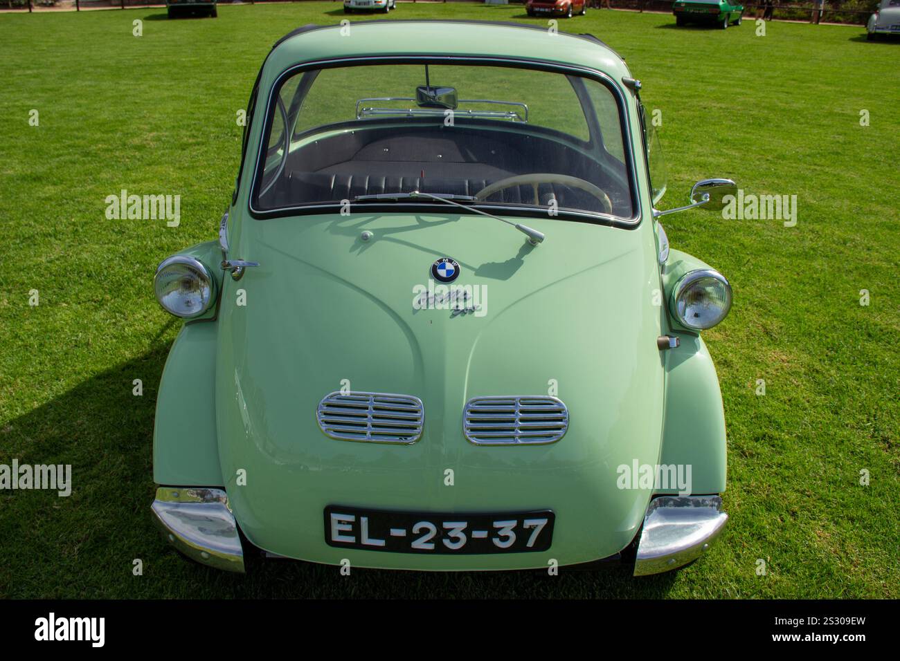 Light green bmw isetta 300 parked on a grass field at a classic car ...