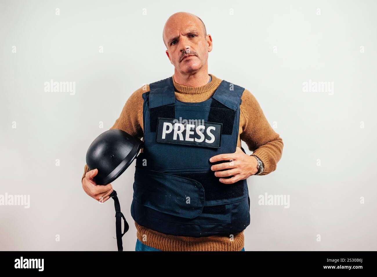 Reporter with bulletproof vest on white background Stock Photo - Alamy