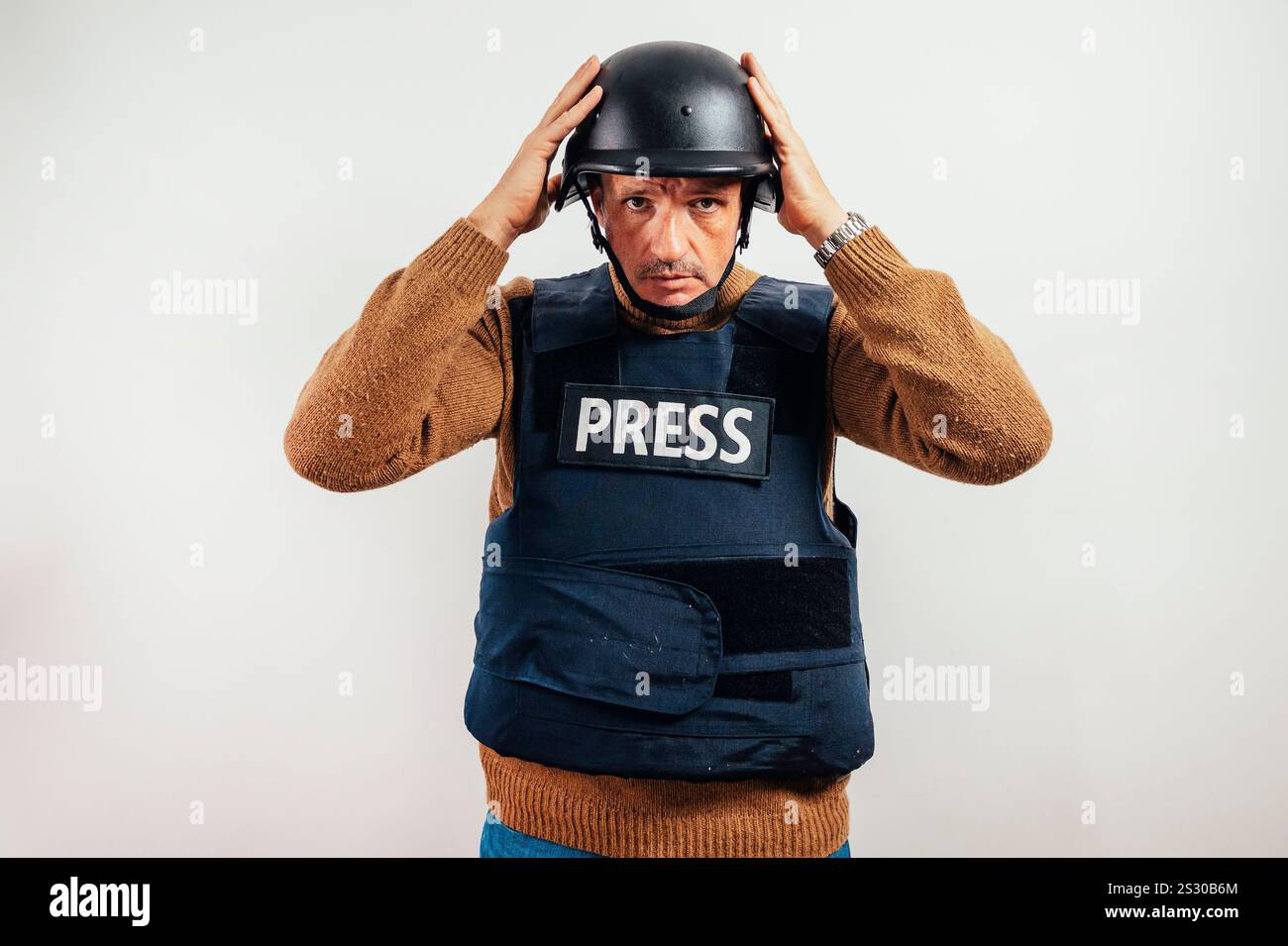 Reporter with bulletproof vest on white background Stock Photo - Alamy