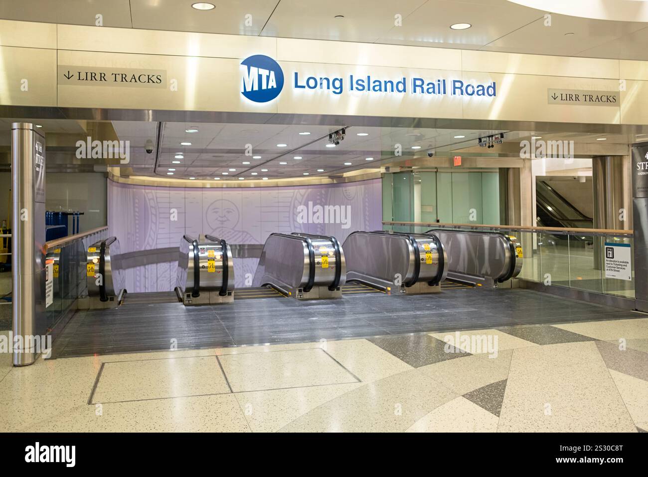 The stairs & escalator to the Long Island Rail Road train platforms in ...