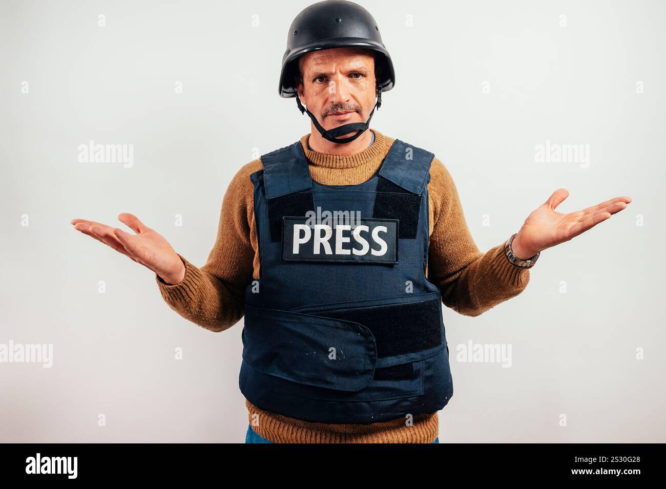 Reporter with bulletproof vest on white background Stock Photo - Alamy