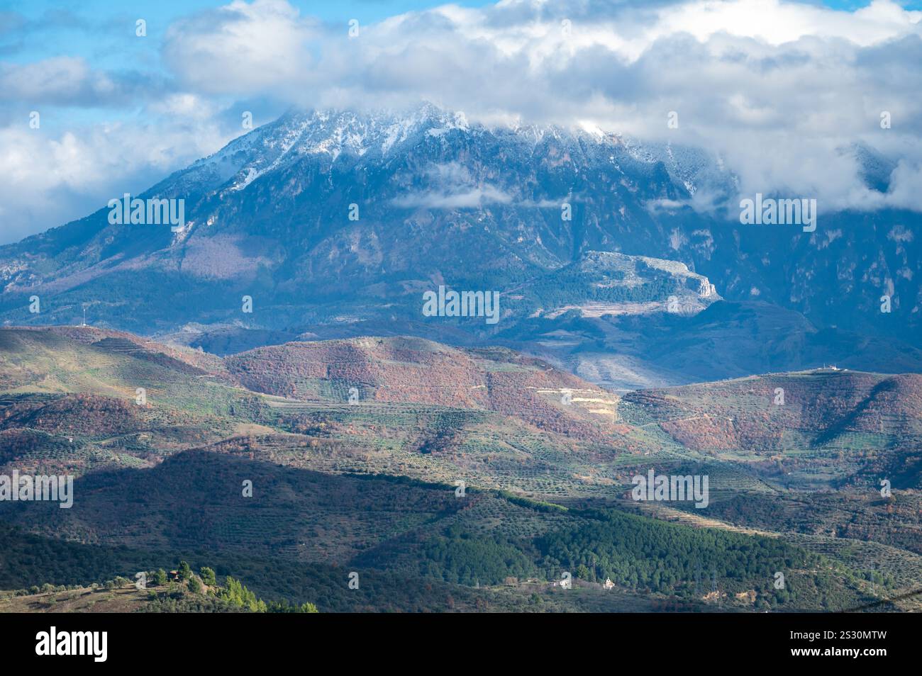 Snow topped mountains with fog and green hills around Berat, Albania ...