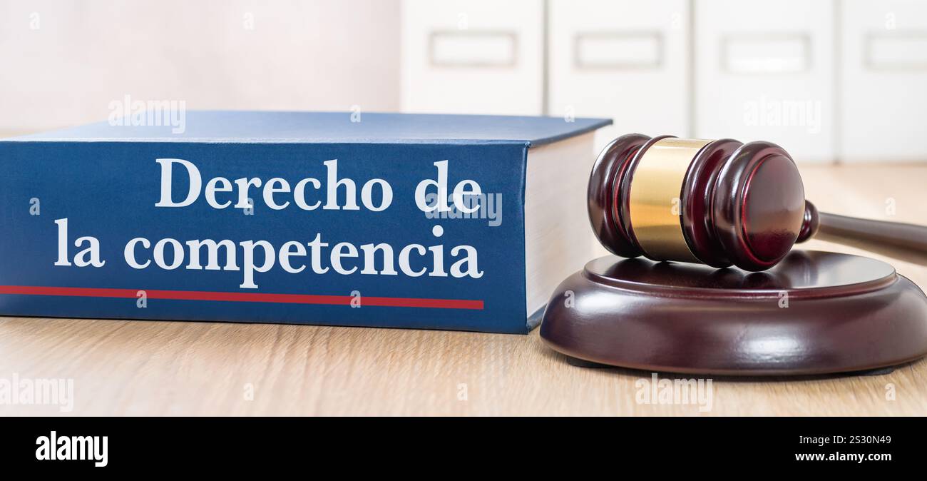 A law book with a gavel - Competition law in spanish Stock Photo - Alamy