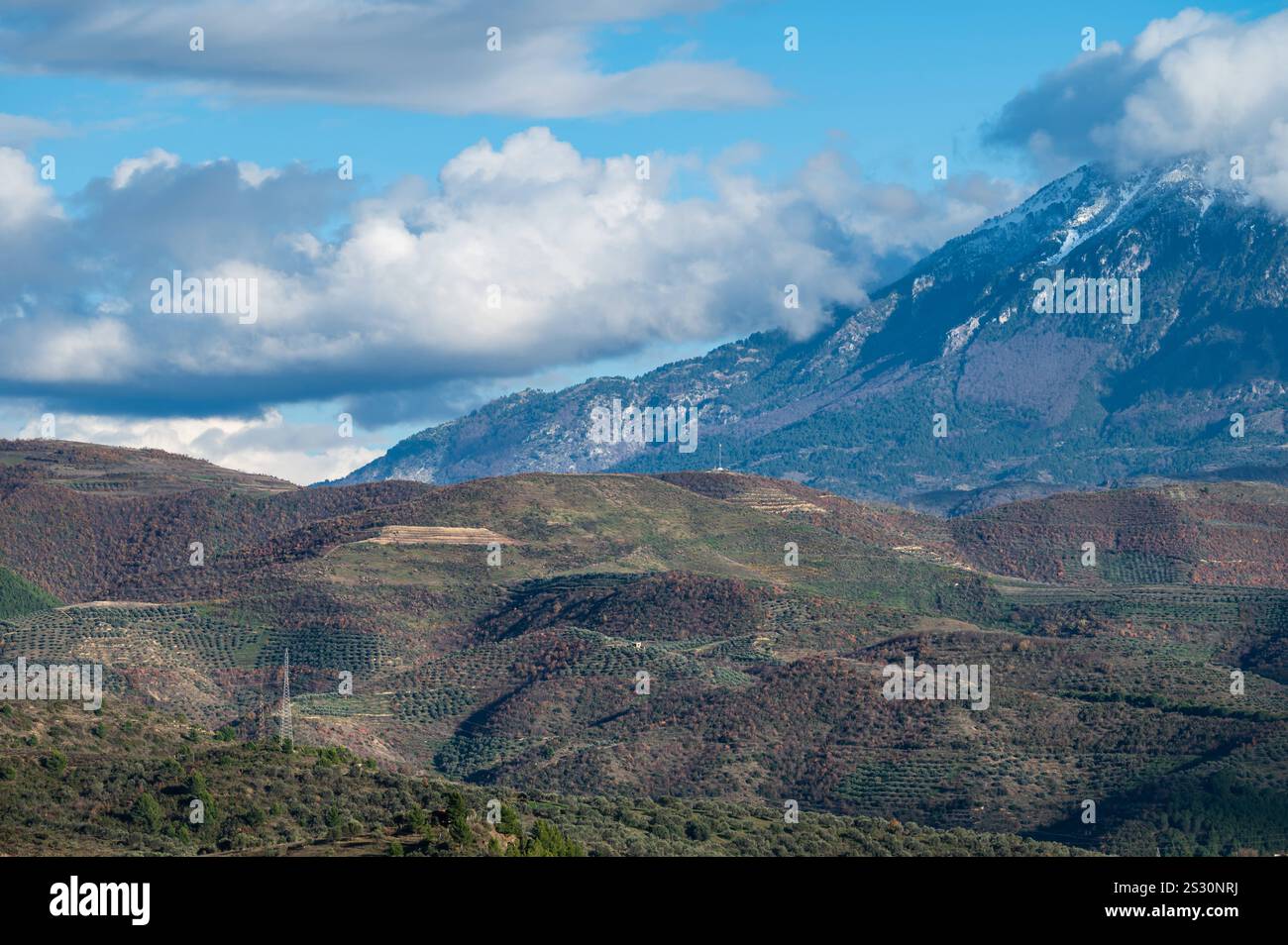 Snow topped mountains and green hills around Berat, Albania Stock Photo ...