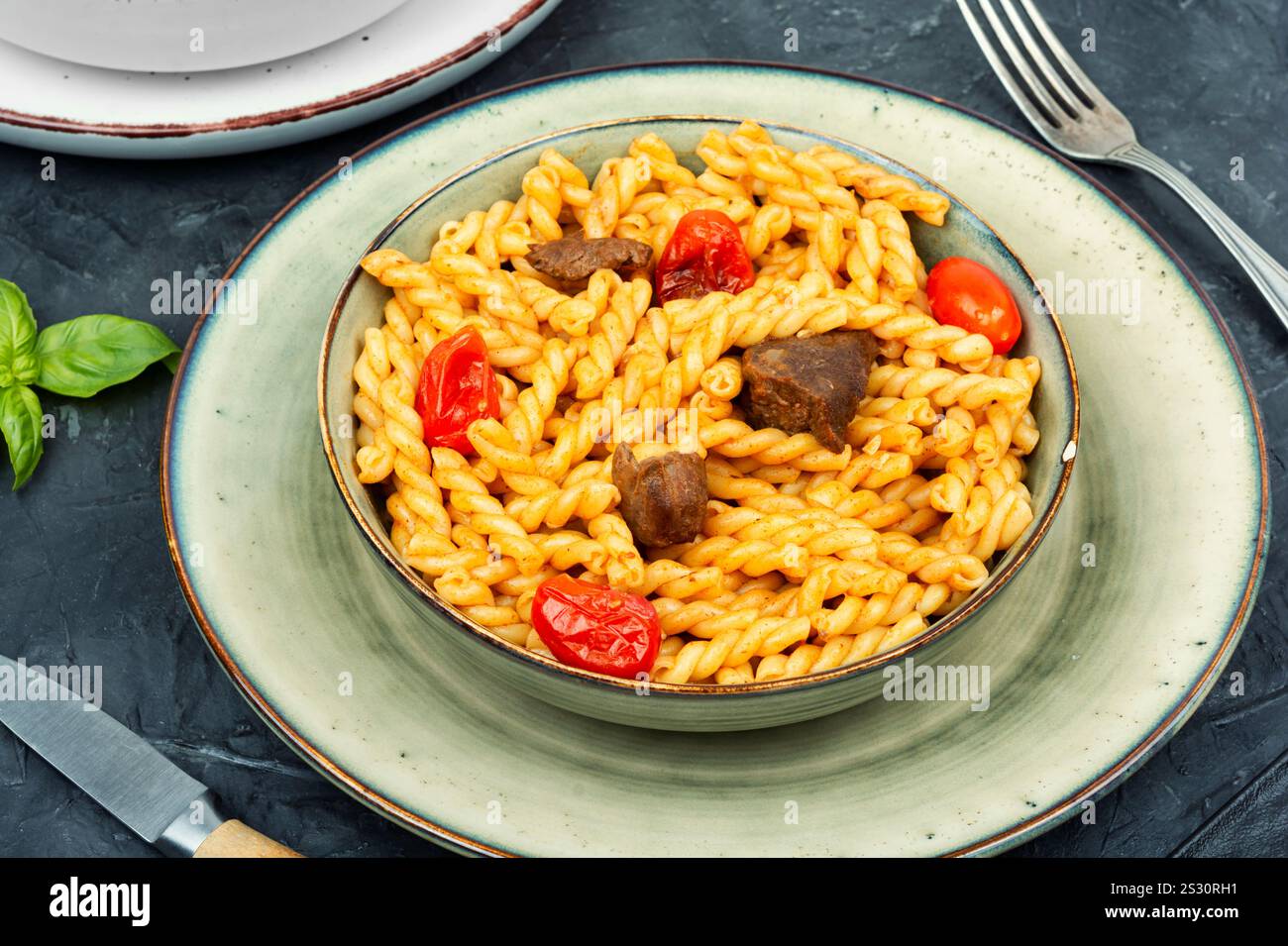 Tasty boiled and fried macaroni or pasta with beef and vegetables Stock ...