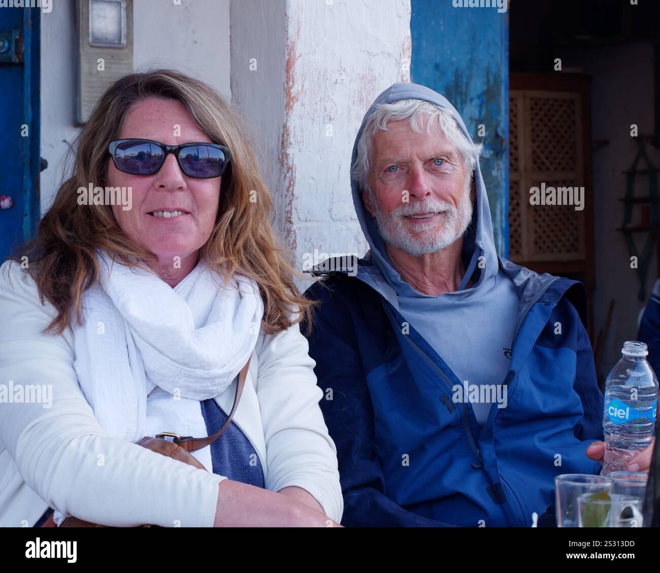 Endearing elderly man with blonde hair and blue eyes beside a smiling ...