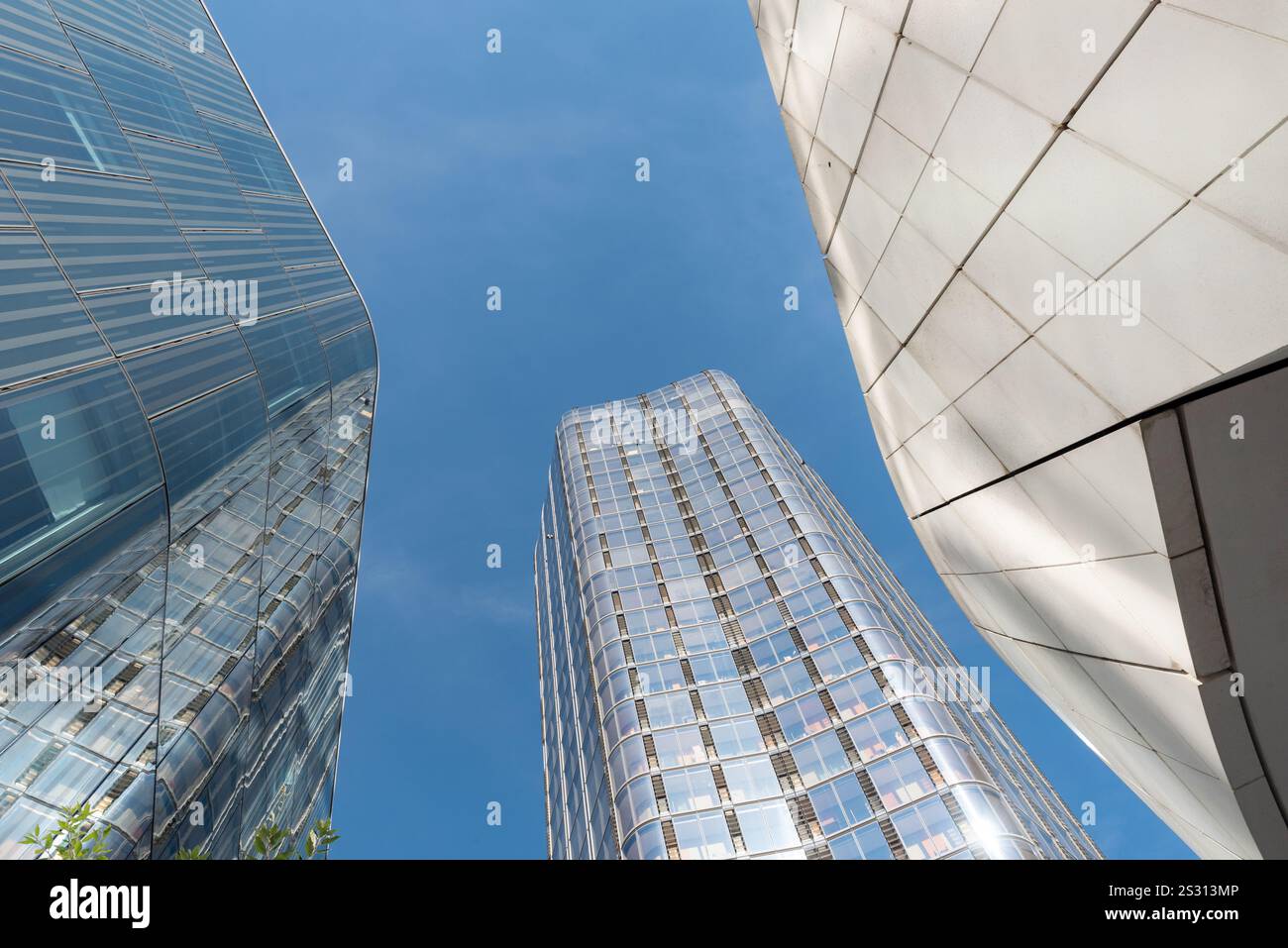 Conceptual futuristic modern glass fronted high rise office buildings ...