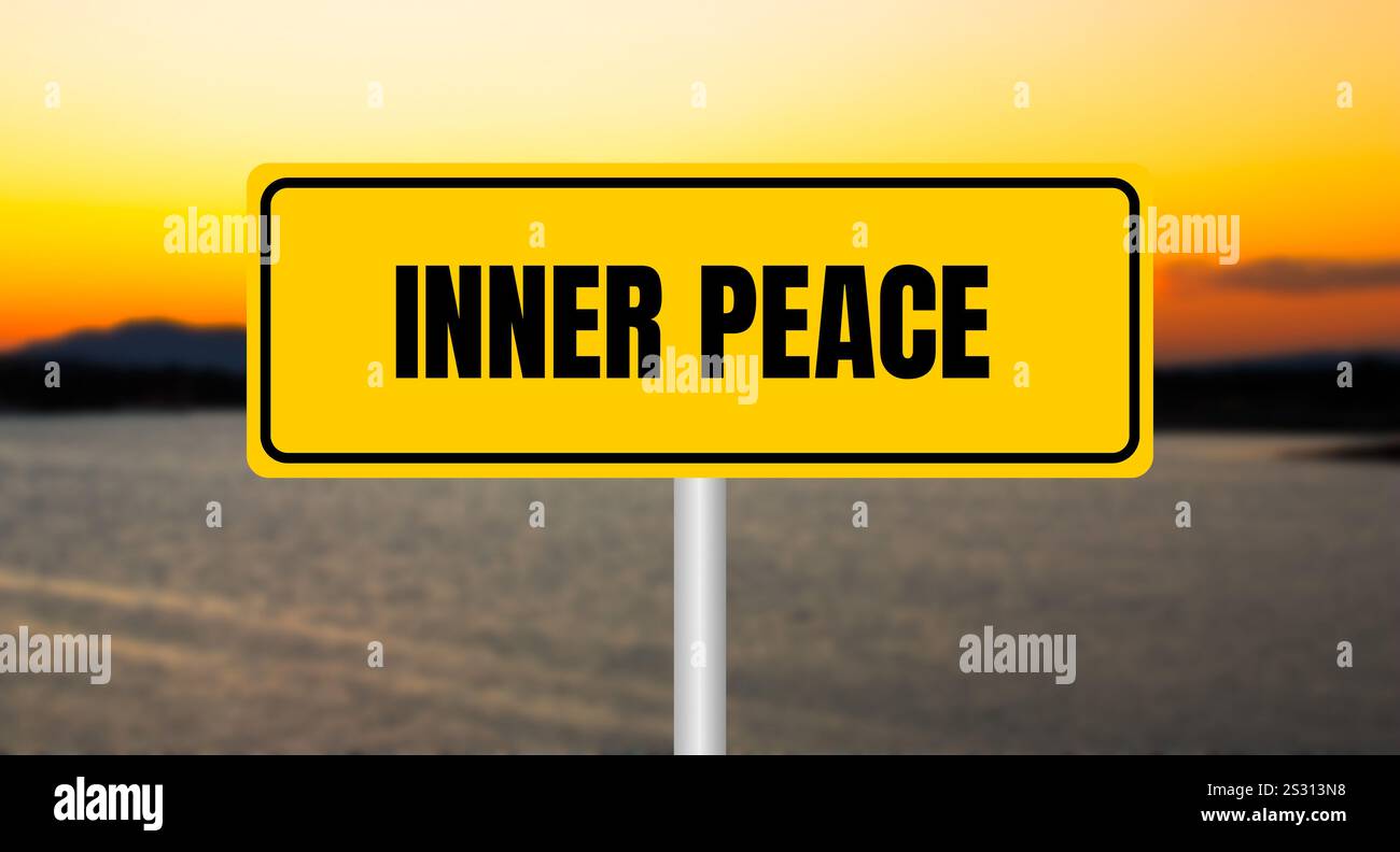 Inner peace message written on yellow sign with blurry lake background ...